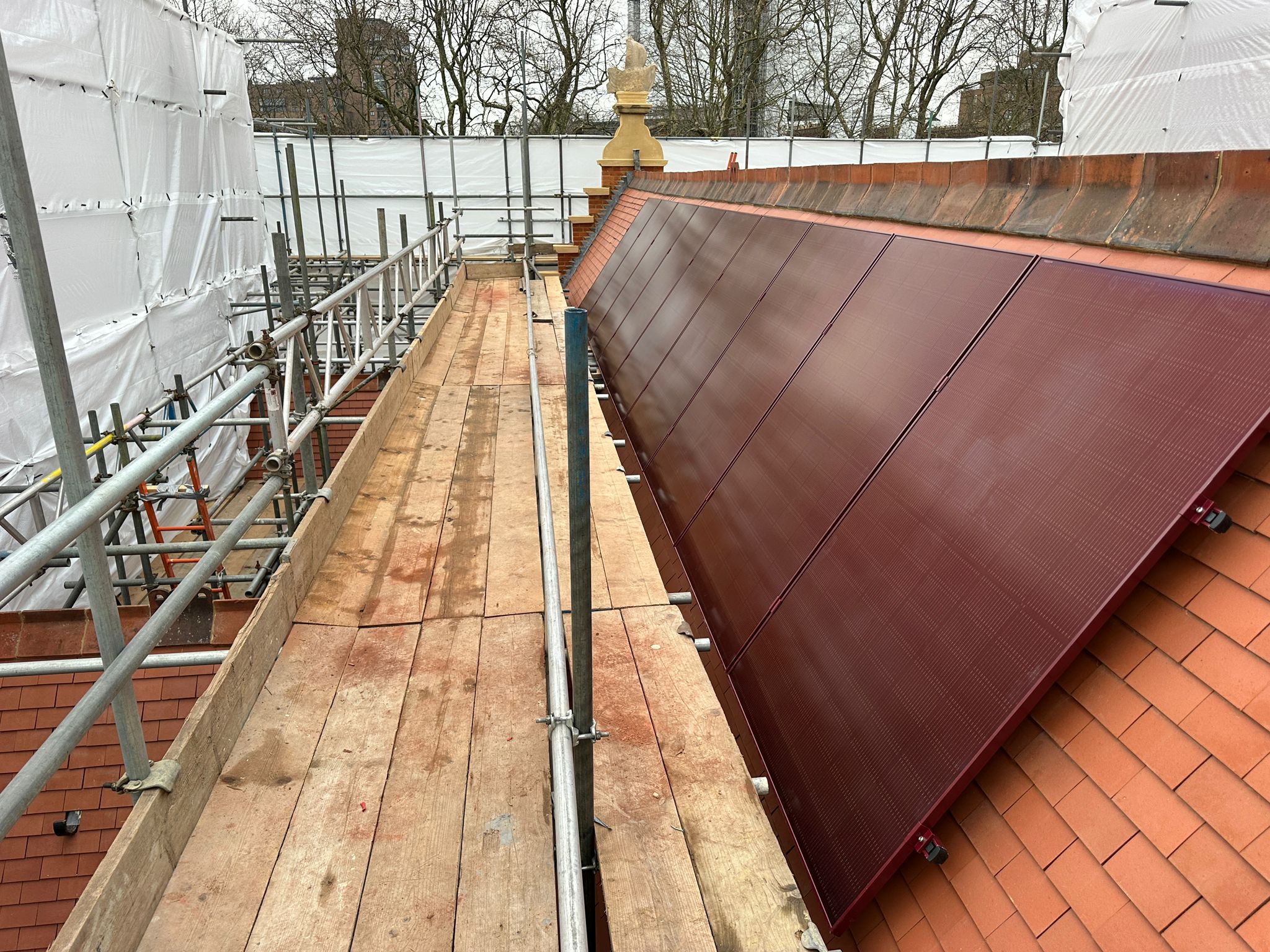 Bespoke Red Solar Panels Installed - AES Limited